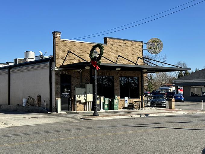 The humble brick exterior of Busy Bee Café stands like a beacon of breakfast hope, its cheerful yellow sign promising delicious revelations within.