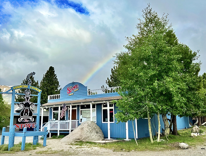 The iconic blue exterior of The Stove with its vintage sign promising "Country Cookin'" stands like a beacon for breakfast pilgrims in Mammoth Lakes.