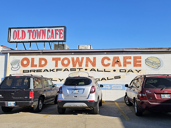 The unassuming exterior of Old Town Cafe stands as a beacon for breakfast lovers, promising "BREAKFAST ALL DAY" like a mantra for the hungry masses.