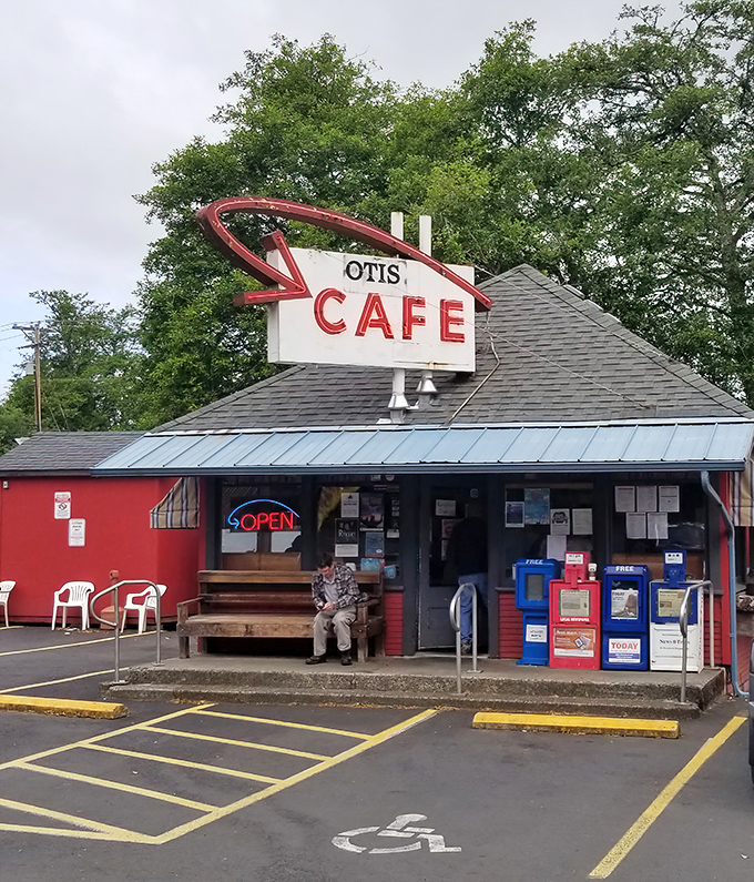 The iconic red exterior and vintage neon sign of Otis Cafe stands like a beacon for hungry travelers. This roadside gem has been calling breakfast pilgrims to Highway 18 for generations.