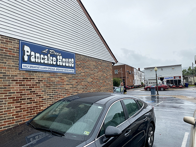 The unassuming brick exterior of L'Dees Pancake House, where the retro signage signals you've found a true local treasure. 