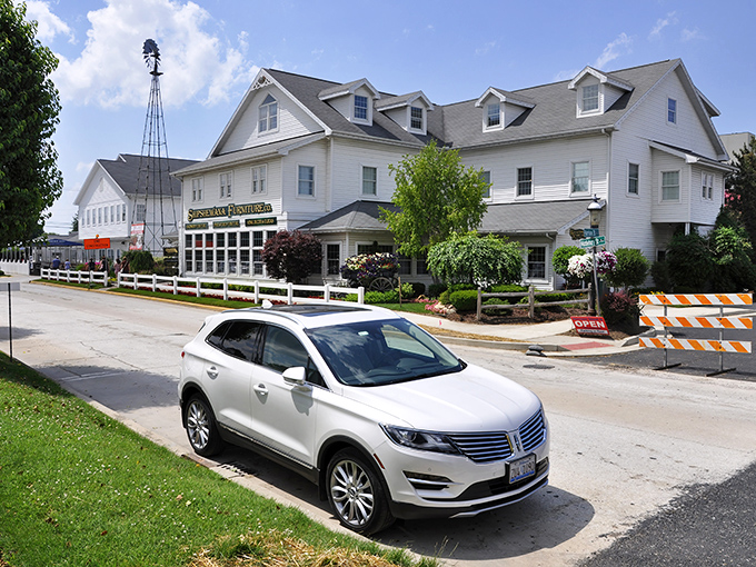 A serene koi pond welcomes visitors to Blue Gate, where tranquility begins before you even reach the front door.