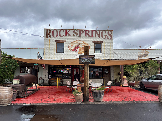 The iconic white facade of Rock Springs Caf&eacute; stands proudly against the Arizona sky, with that painted pie slice practically winking at hungry travelers on I-17.