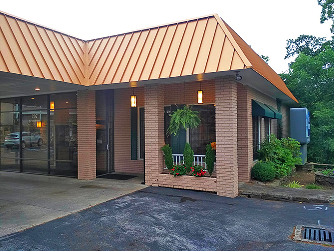 The welcoming entrance to Myrtie Mae's promises Ozark hospitality before you even step inside. That copper roof practically winks at you on sunny days.