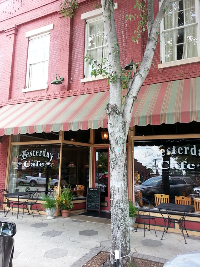 The red-trimmed entrance of The Yesterday Cafe beckons like an old friend, promising comfort food and conversations that linger longer than dessert.