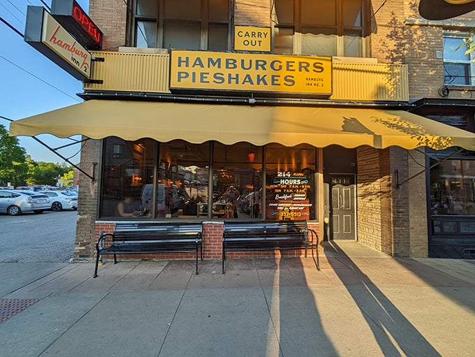 The iconic yellow awning of Hamburg Inn No. 2 beckons like a culinary lighthouse on Linn Street, promising comfort food that's stood the test of time since 1948.