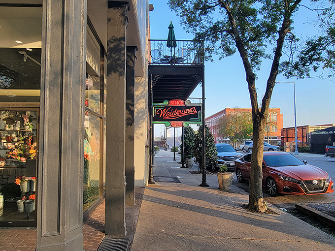 The iconic neon sign of Weidmann's glows like a beacon of culinary hope on a downtown Meridian street. Southern hospitality awaits just beyond those doors. 