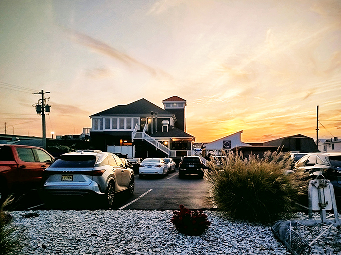 Sunset magic at Harris Crab House, where the golden hour transforms this waterfront gem into a postcard-worthy scene that whispers, "Come for dinner, stay for the view."