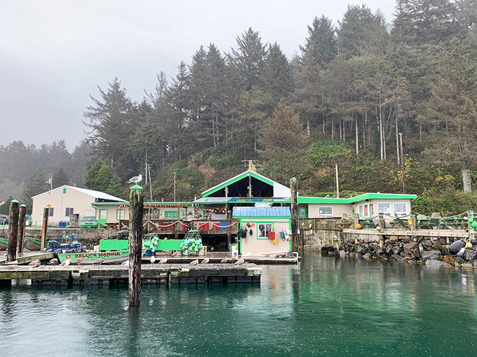 Kelly's Brighton Marina emerges from the mist like a seafood mirage, its emerald-green buildings a beacon for hungry travelers navigating Oregon's coastal wonderland.
