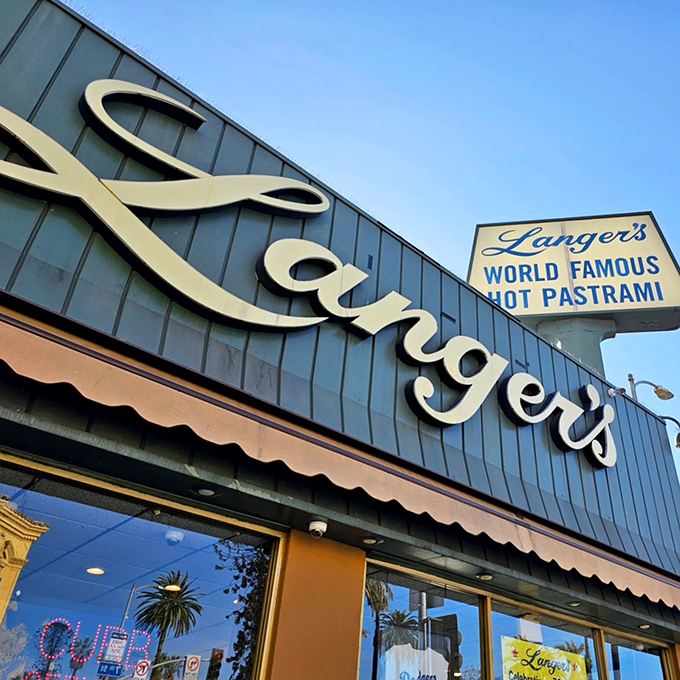 The iconic mint-green exterior of Langer's stands proudly at 7th and Alvarado, a beacon of pastrami perfection since 1947.