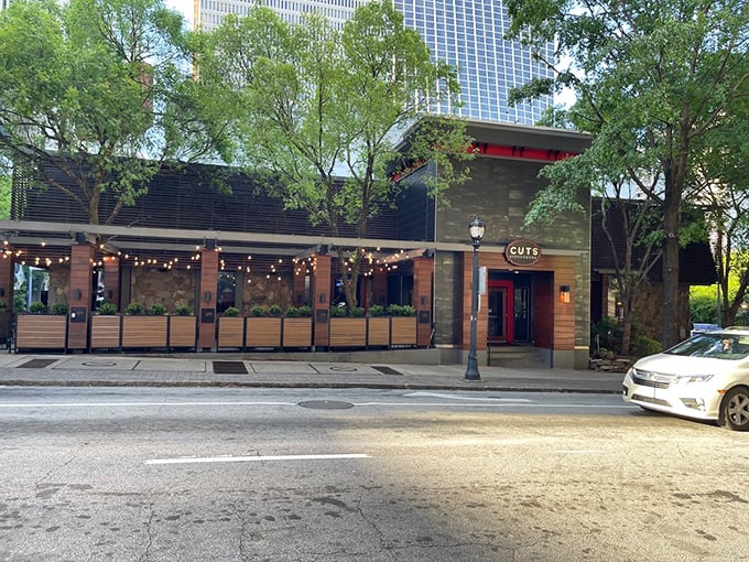The unassuming exterior of Cuts Steakhouse belies the culinary magic happening inside. Like finding a diamond in downtown Atlanta's concrete jungle.