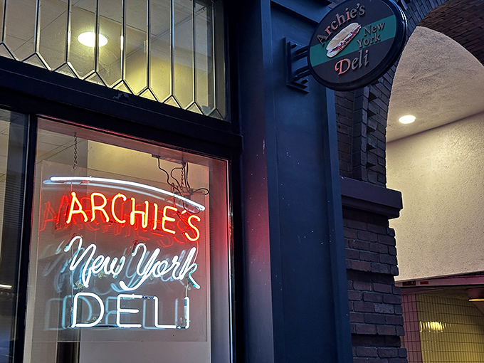 The iconic Archie's sign beckons sandwich pilgrims with its simple promise: authentic New York deli fare in the heart of Boston.
