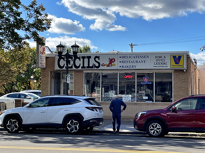 Welcome to Cecil's, where the neon sign promises delicatessen delights and the brick facade holds decades of delicious secrets!