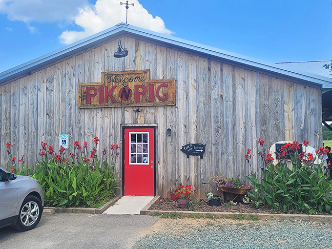 The weathered wooden exterior with that bold red door isn't trying to impress anyone&mdash;and that's precisely why it does. Southern barbecue authenticity at its finest. 