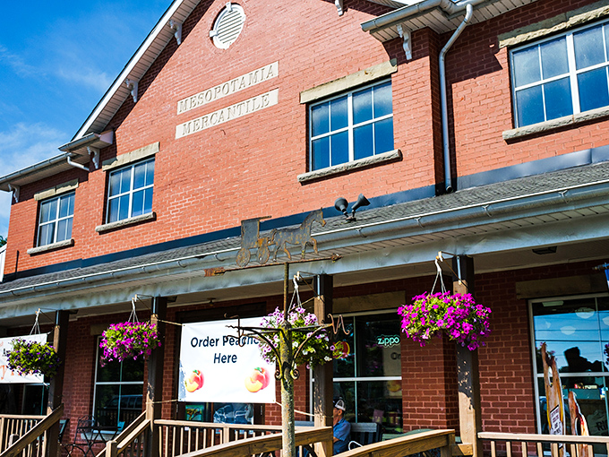 The white-columned porch and patriotic bunting aren't just for show&mdash;they're your first clue that authentic Americana awaits inside this red brick treasure.
