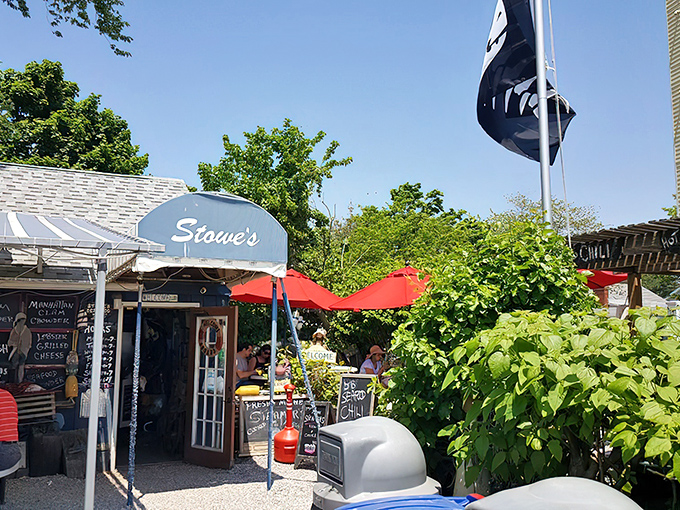 Pirate flags flutter above this unassuming seafood haven, where the American flag stands tall and wooden benches await seafood pilgrims ready for treasure.