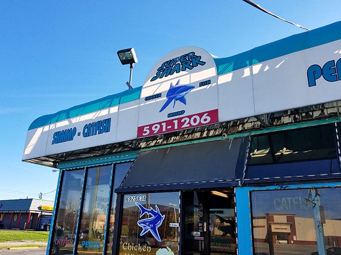 The blue awning of Super Shark beckons like a maritime mirage in landlocked Indianapolis. Who knew seafood paradise was hiding behind that shark logo all along?