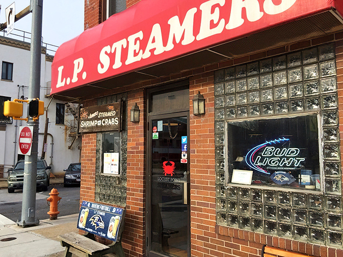 The corner brick building with its iconic vertical "STEAMERS" sign stands like a lighthouse for hungry seafood pilgrims in Baltimore's Locust Point neighborhood.