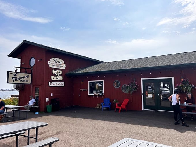 The little red fish shack that could! The Fisherman's Daughter stands proudly on Grand Marais' harbor, promising seafood treasures within its humble walls.