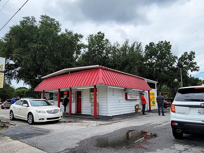 The iconic red-roofed shack draws a steady line of locals who know that culinary treasures often hide in the most unassuming packages.