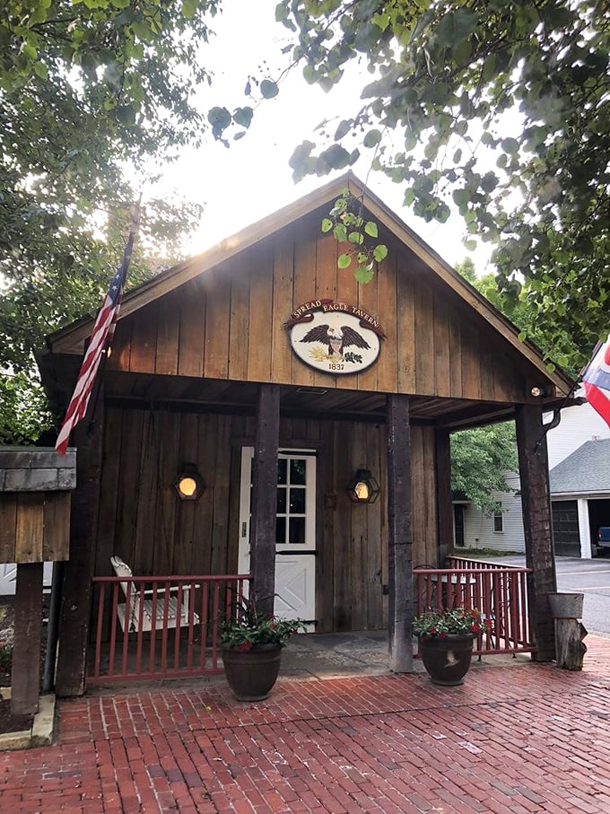 History stands tall at the Spread Eagle Tavern, where the rustic wooden exterior and iconic eagle emblem have welcomed travelers since Andrew Jackson's presidency.