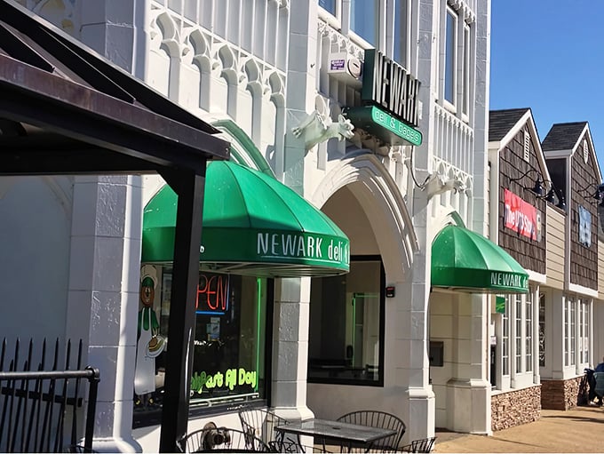 The distinctive white facade with emerald green awnings of Newark Deli & Bagels stands out like a culinary beacon on Main Street.