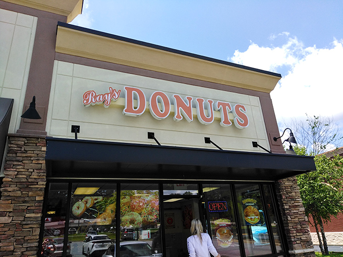 The siren call of that "Donuts" sign hits different at 7am &ndash; Ray's storefront promises morning salvation in strip mall form.