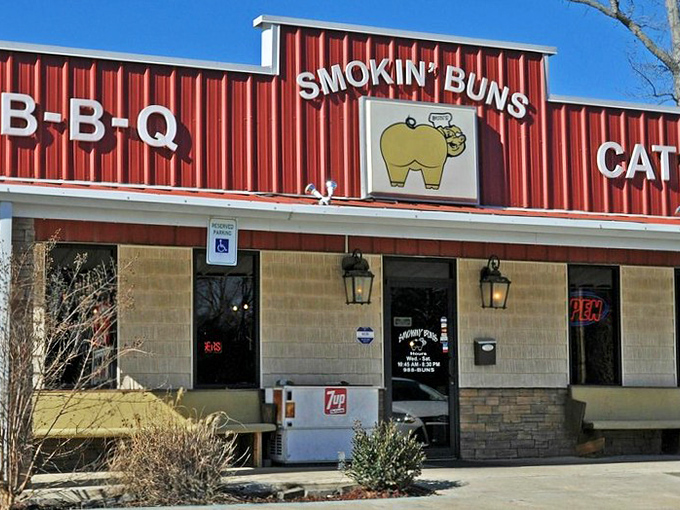 The culinary shrine beckons with its no-nonsense red facade, promising two sacred Arkansas food groups: BBQ and catfish. No fancy frills needed.