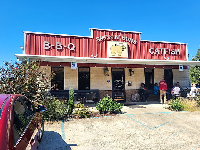 The culinary shrine beckons with its no-nonsense red facade, promising two sacred Arkansas food groups: BBQ and catfish. No fancy frills needed.