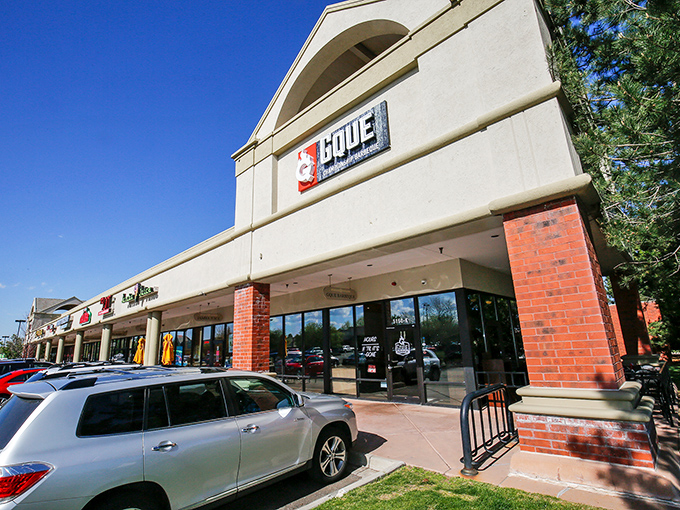 GQue's unassuming storefront hides barbecue greatness like a superhero's secret identity. The real magic happens behind those glass doors.