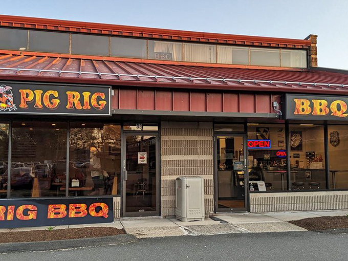 The unassuming exterior of Pig Rig BBQ in Wallingford hides a smoky paradise within. Like finding a diamond in the rough, but the diamond is brisket.