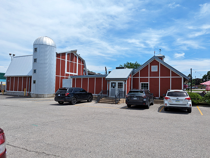 The red barn exterior isn't just charming—it's a smoke signal to barbecue lovers that something magical is happening inside those walls.
