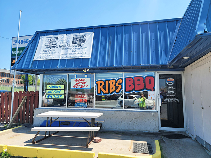 The blue exterior of Wayne's New Skoo BBQ beckons like a smoke signal to hungry travelers. This unassuming strip mall spot proves Nebraska's barbecue scene is no flyover affair.