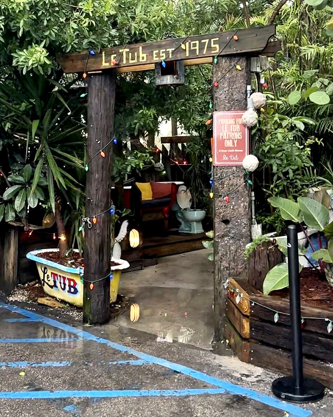The unassuming entrance to burger paradise. Like finding a pirate's treasure map disguised as a fence, Le Tub's weathered exterior hides culinary gold within.