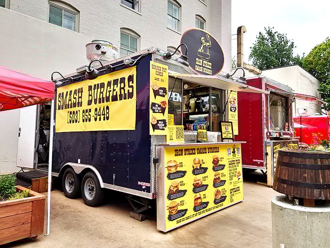 The bright yellow beacon of burger bliss stands proudly among Portland's food carts. Like a culinary lighthouse guiding hungry souls to smash burger paradise.