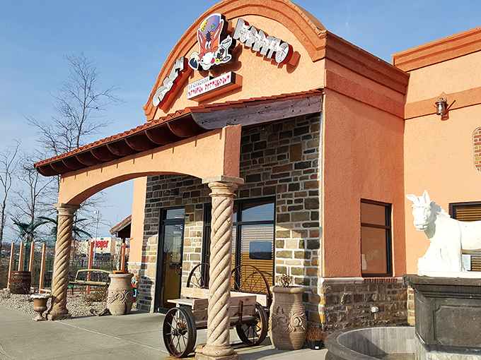 Stone archways and vibrant orange walls create the perfect backdrop for what's about to become your new favorite Mexican escape in Ohio.