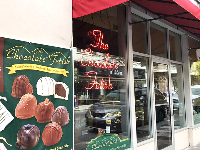 The storefront beckons like a chocolate siren, with award certificates proudly displayed. Resistance is futile&mdash;just look at that "OPEN" sign glowing with promise.