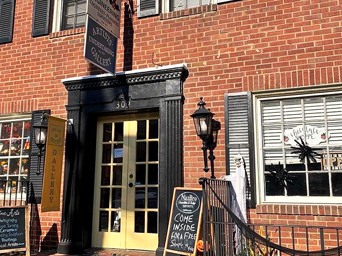 The unassuming brick storefront of NazBro Chocolates beckons with a promise that's impossible to resist: FREE FUDGE SAMPLES. Resistance is futile.