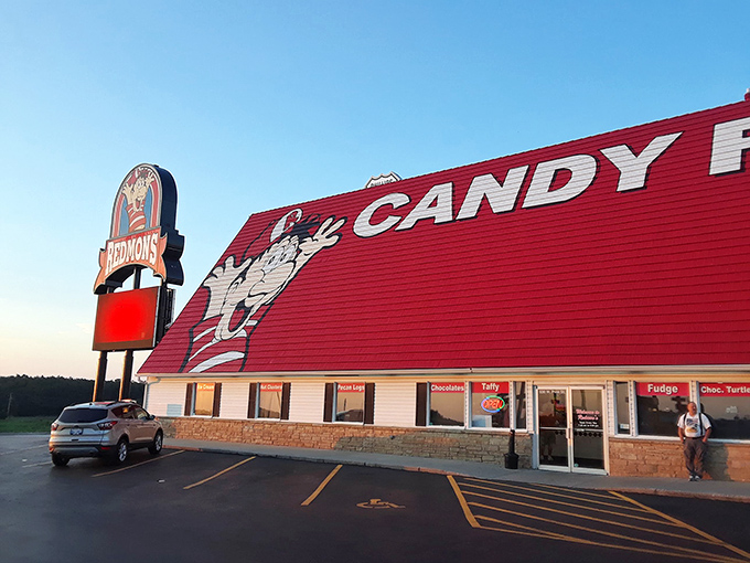 A candy lover's beacon on I-44, Redmon's iconic red roof and cartoon mascot promise sweet salvation just minutes from your sensible driving schedule.