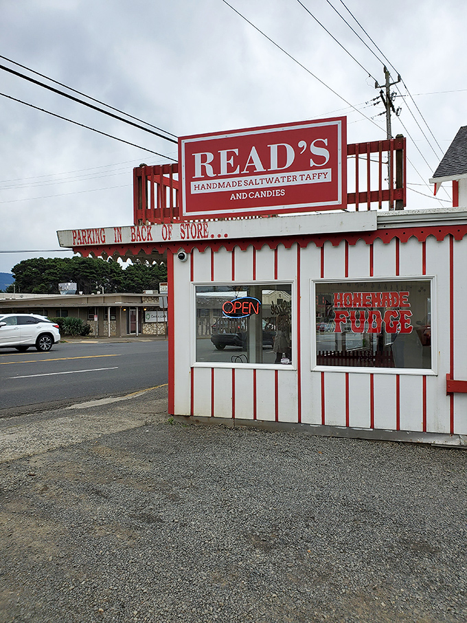 The candy-striped wonderland of Read's Homemade Candies stands like a sweet mirage on Highway 101, promising sugar-fueled bliss to coastal travelers.