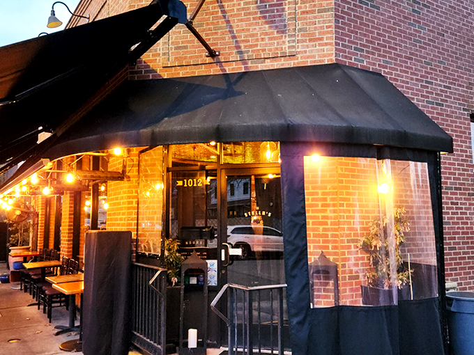 Stella's brick exterior with its elegant black awning creates the perfect first impression &ndash; unpretentious yet inviting, like a warm Greek hug waiting to happen.