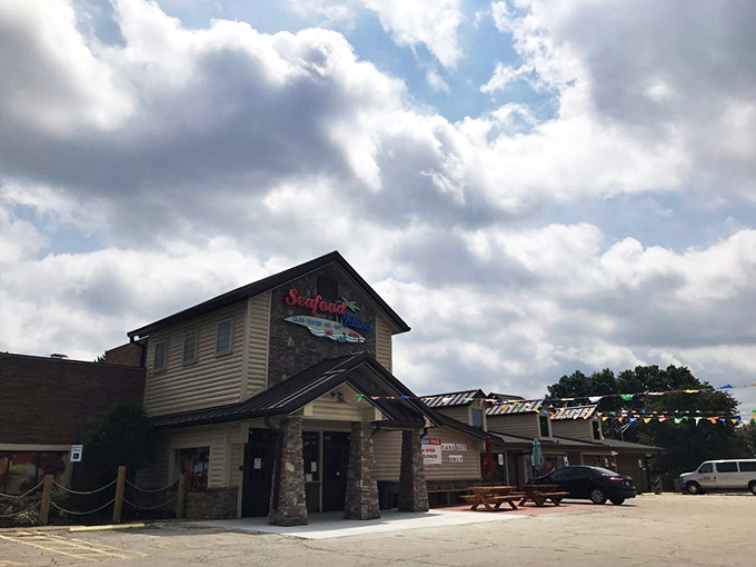 The unassuming exterior of Seafood Island stands like a coastal mirage in suburban Shawnee, promising oceanic treasures in the most landlocked of settings.
