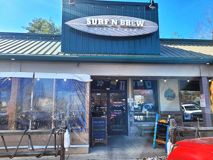 The surfboard sign announces your arrival at seafood paradise &ndash; where mountain air meets maritime flavor in Fletcher's unexpected coastal outpost.