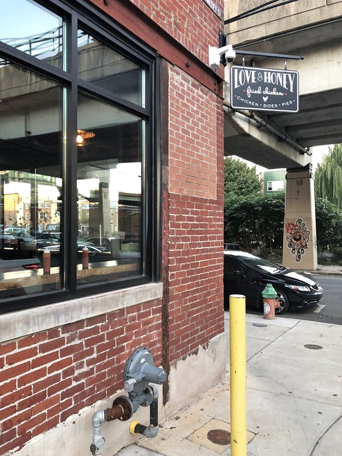 The unassuming brick facade of Love & Honey Fried Chicken in Northern Liberties hides culinary treasures that would make Colonel Sanders weep with envy.