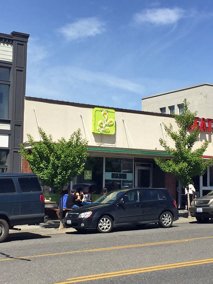 The unassuming exterior of Ma'ono hides culinary treasures within, like finding a rare vinyl record in a plain sleeve. That bright green chicken sign is your beacon to fried chicken nirvana.