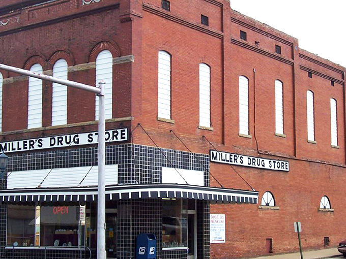 Malvern's Main Street at dusk captures that perfect small-town moment when the streetlights flicker on and the brick buildings glow with warmth and history.
