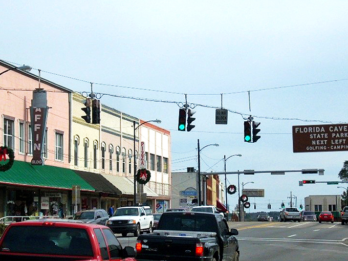 Downtown Marianna's historic buildings stand as colorful sentinels of small-town charm, where brick facades tell stories that parking meters can't charge for.