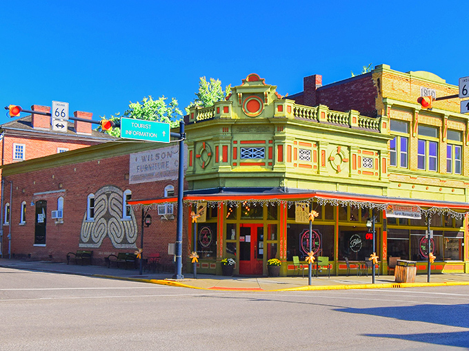 Historic brick facades line New Harmony's main street, where 19th-century architecture meets small-town charm in a perfectly preserved tableau.