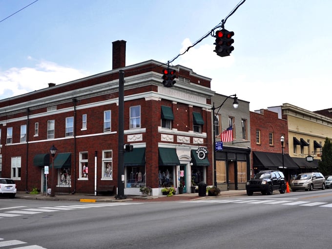 Bardstown's courthouse stands like a Victorian sentinel watching over the town square, its brick fa&ccedil;ade glowing warm in the golden hour light.
