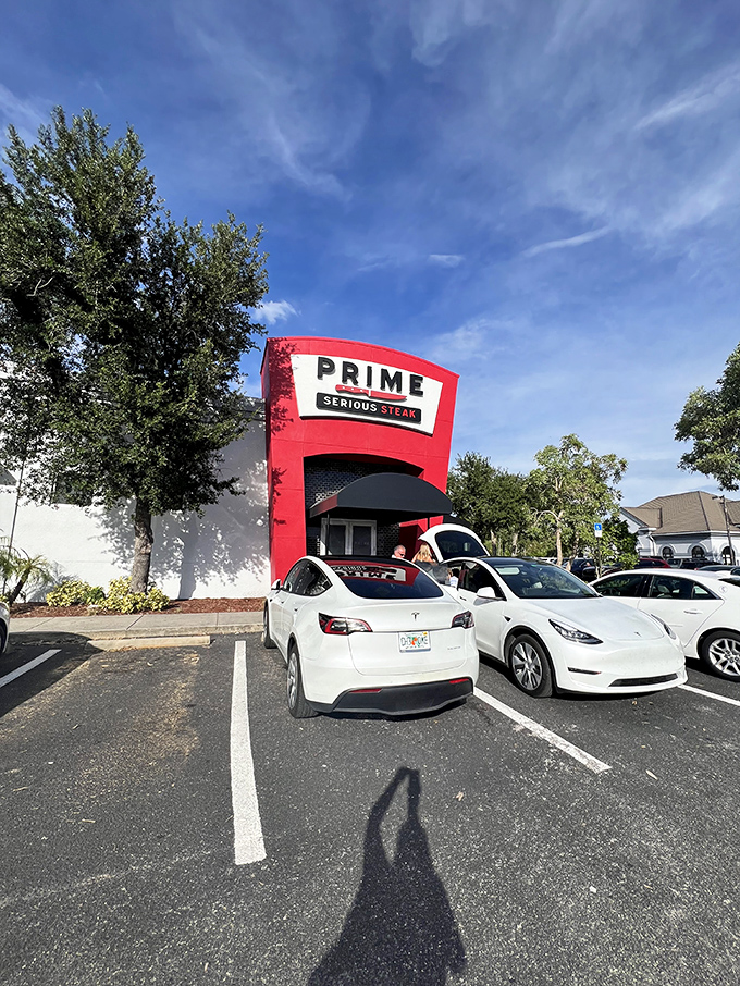 The bold red exterior doesn't whisper, it announces: "Serious steak happens here." This architectural meat manifesto in Port Charlotte means business.